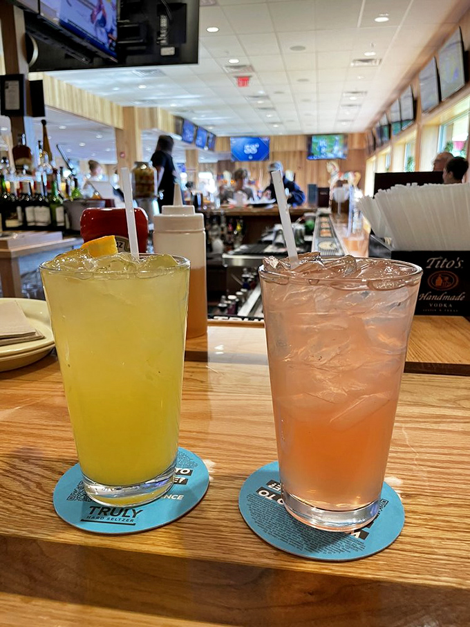 Cold drinks await their moment of glory, standing by to rescue taste buds from the delicious heat of pizza and Nic-o-bolis.