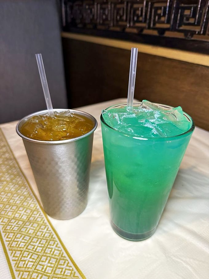 One golden, one turquoise&mdash;these drinks aren't just beverages, they're tropical vacations in a glass waiting at your table.