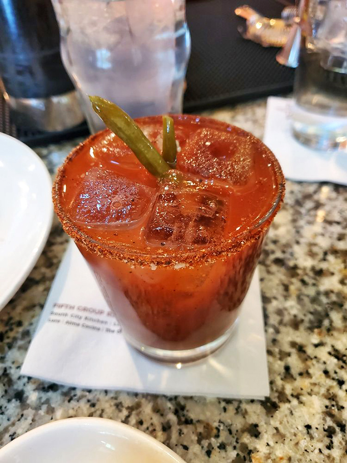A Bloody Mary garnished with enough personality to start conversations. The pickle is just showing off.