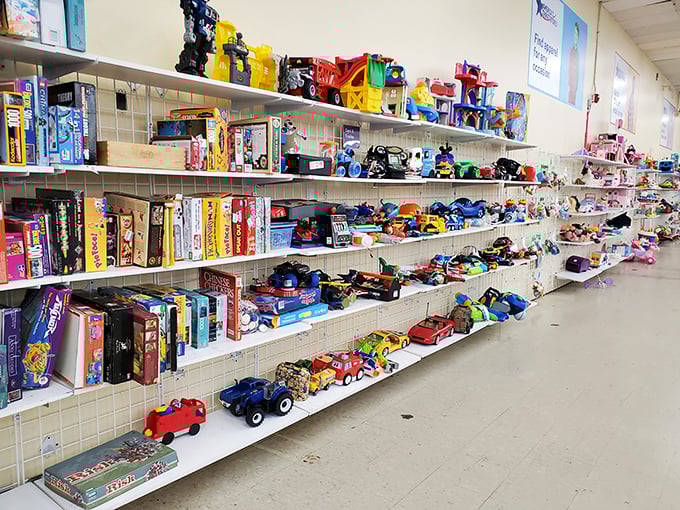 Childhood memories line these shelves, where board games and toy cars await new families to create fresh adventures.