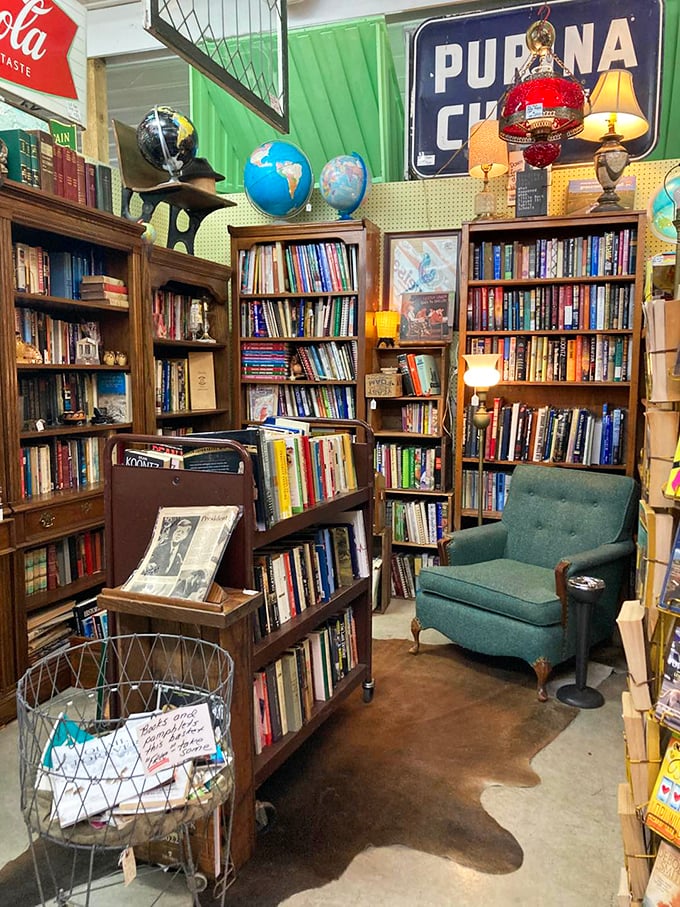 The bookworm's dream corner&mdash;complete with mid-century reading chair and enough vintage volumes to make you forget there's anything else in the store.