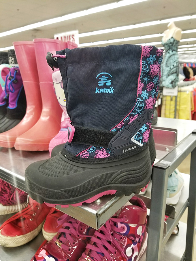 Winter-ready Kamik boots stand at attention next to pink rain galoshes, ready to tackle whatever weather Connecticut throws your way.