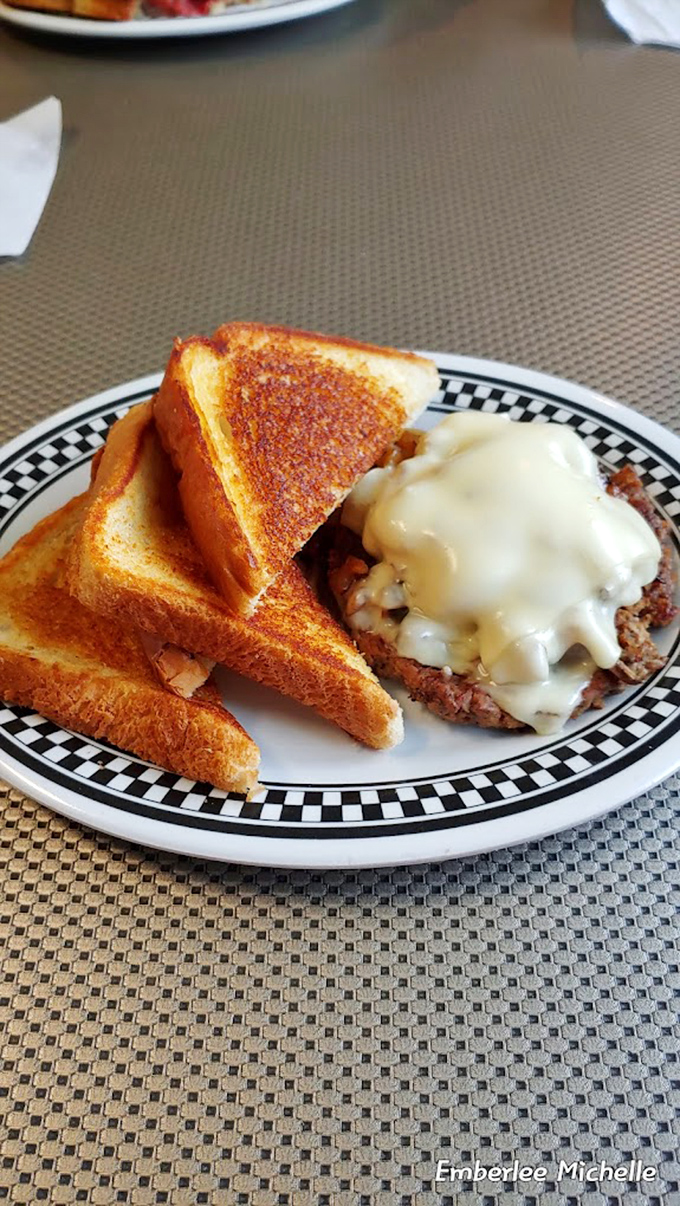 Golden toast triangles flanking what appears to be breakfast's greatest hit. That melted cheese blanket is performing acts of culinary kindness.