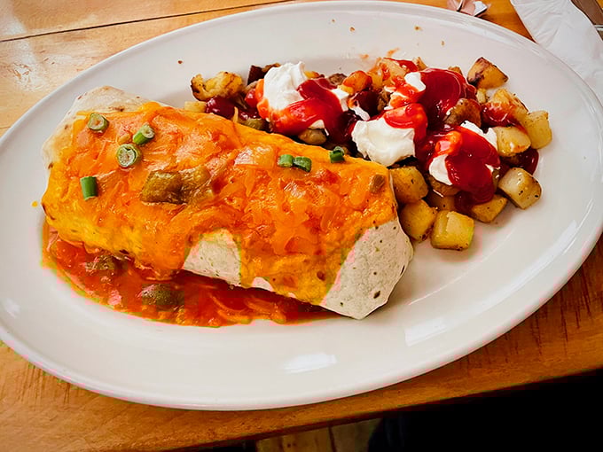 When a burrito gets dressed up for a special occasion. That cheese blanket and those crispy potatoes are what breakfast dreams are made of.