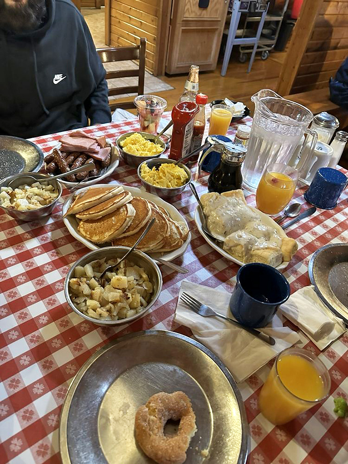 Family-style dining at its finest. The table groans under the weight of breakfast bounty that would fuel a day of tree-chopping or, more likely, napping.