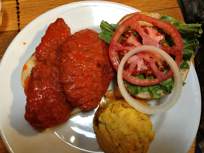 Buffalo sauce meets Southern hospitality on this sandwich. The cornbread muffin alongside isn't just a side&mdash;it's essential equipment for sauce-sopping.