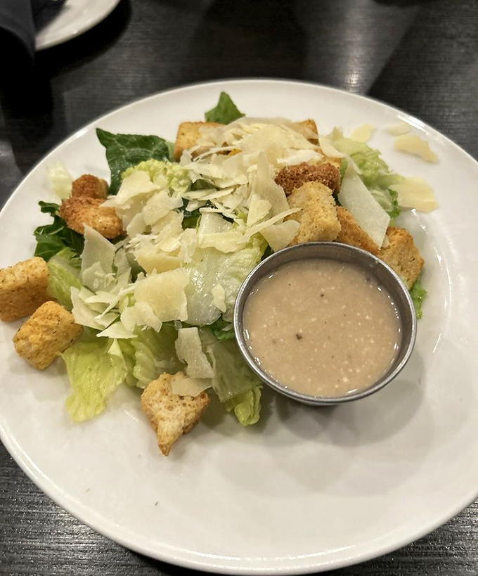 A Caesar salad that Julius himself would approve of&mdash;crisp romaine, generous parmesan shavings, and croutons that actually crunch when you bite them.