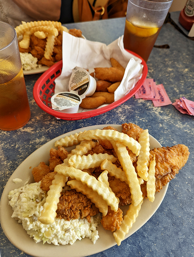 Crispy flounder and plump shrimp share the spotlight with those legendary crinkle fries. This plate has more gold than Fort Knox.