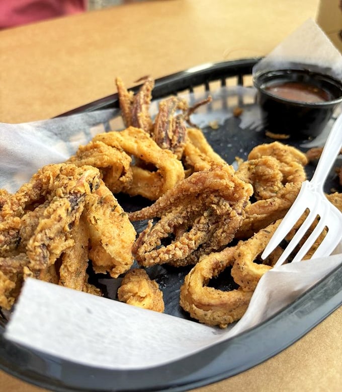 Golden-fried calamari that's actually tender, not rubber bands in disguise. The kind that converts "I don't like calamari" people into "can we order another basket?" people.