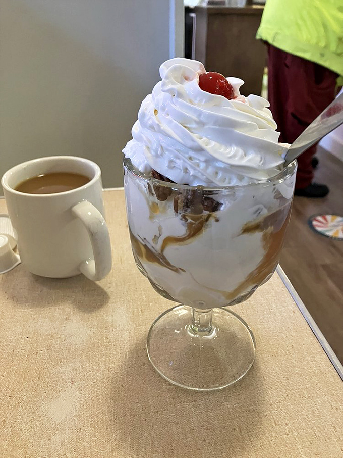 Caramel sauce cascades over vanilla ice cream, creating the kind of dessert worth traveling across state lines to experience.