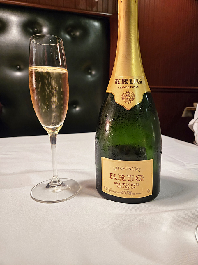 Nothing says "celebration" quite like Krug champagne against a backdrop of tufted leather. Some moments deserve bubbles that cost more than your first car.