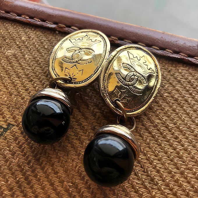 Elegance doesn't expire! These gold and onyx earrings could take you from a PTA meeting to dinner with diplomats without missing a beat.