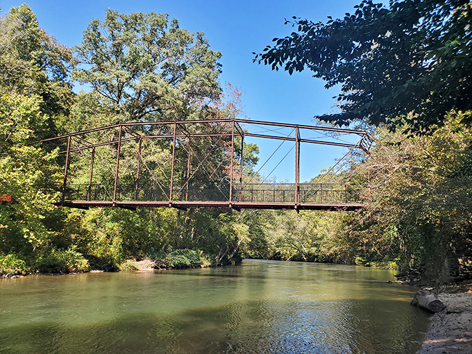 The historic iron bridge spanning the Chestatee River has witnessed generations of gold panners, hikers, and couples stealing quiet moments away from town.