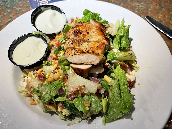 A salad that doesn't feel like punishment. Grilled chicken perches atop a colorful landscape of fresh ingredients&mdash;proof that healthy eating doesn't require sacrifice.