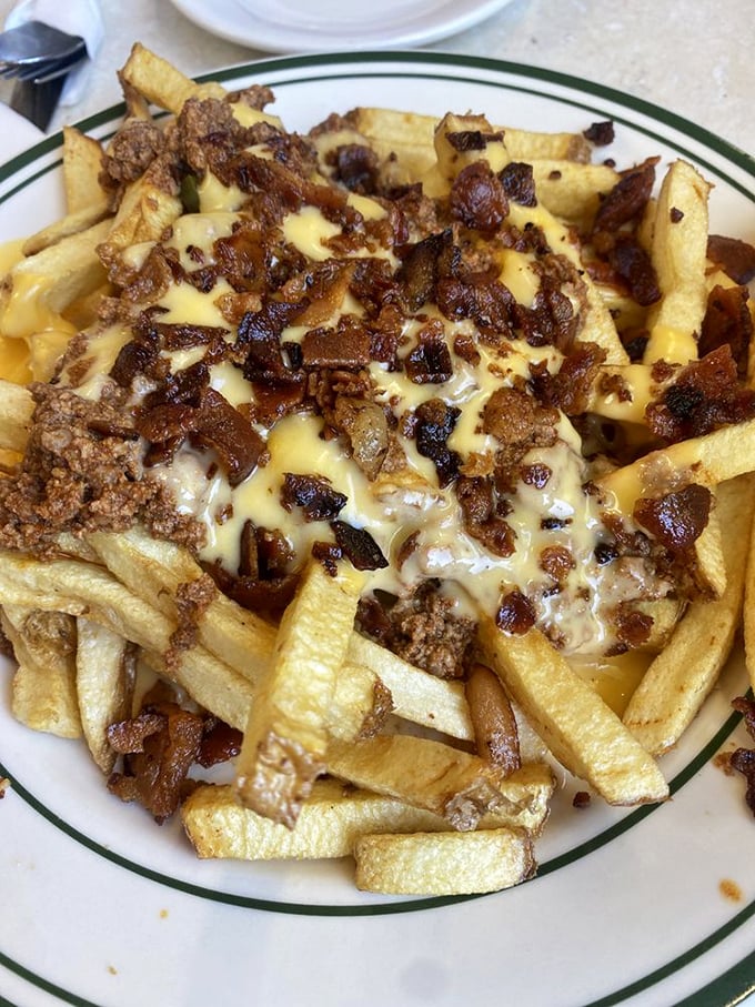 These chili cheese fries aren't just a side&mdash;they're a commitment. The kind of glorious mess that requires both a fork and absolutely no regrets.