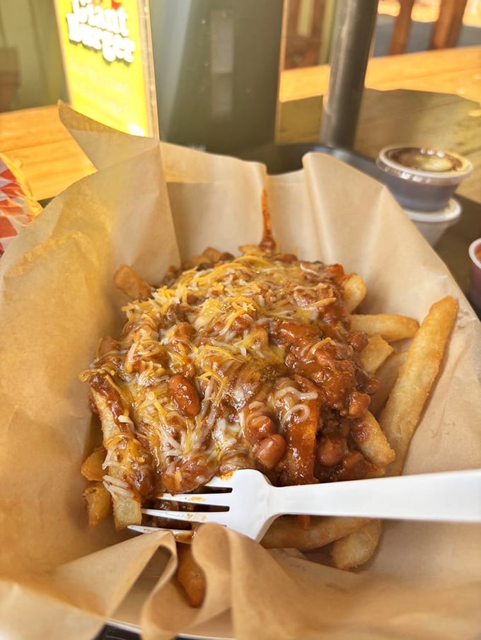 Chili cheese fries that could make a grown adult weep with joy. That melted cheese blanket is tucking in those fries for a flavor nap.