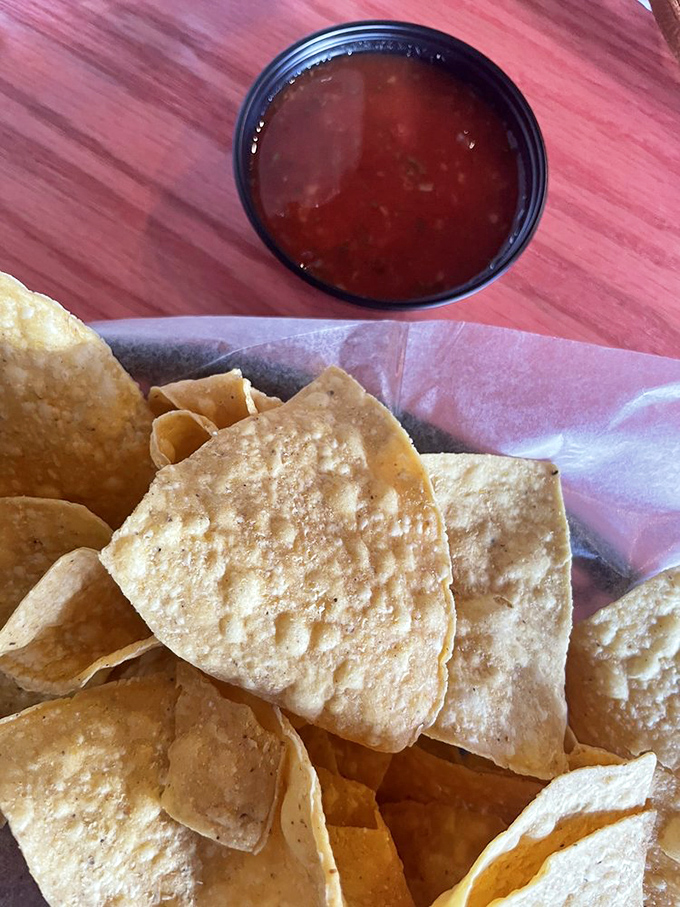 These aren't your sad, stale bar chips&mdash;these are proper, freshly-fried tortilla triangles that crackle with each bite, paired with salsa that means business.