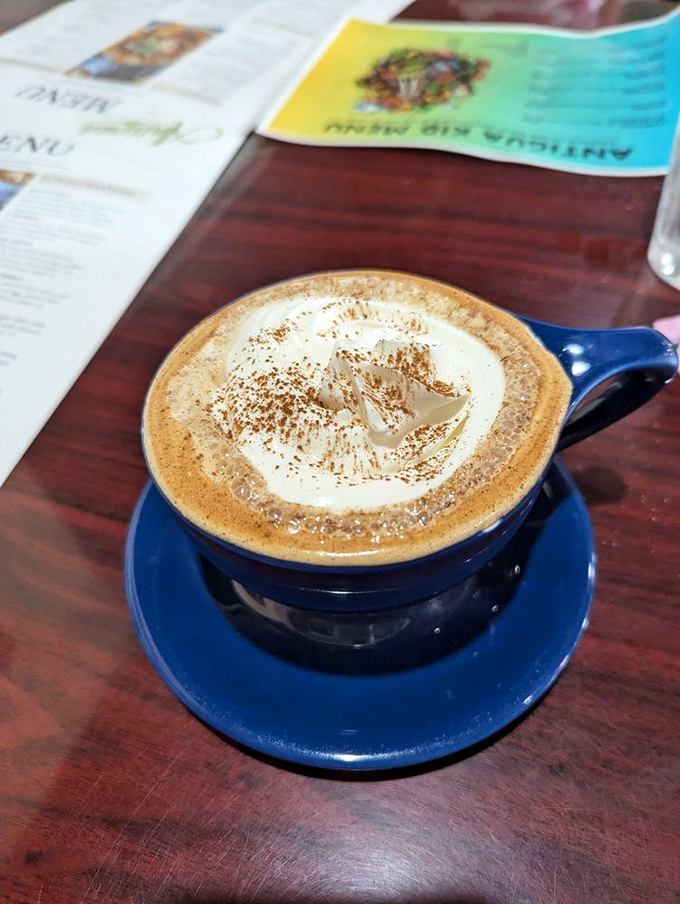 This isn't just coffee; it's a warm hug in a blue mug that makes Monday mornings slightly less criminal.