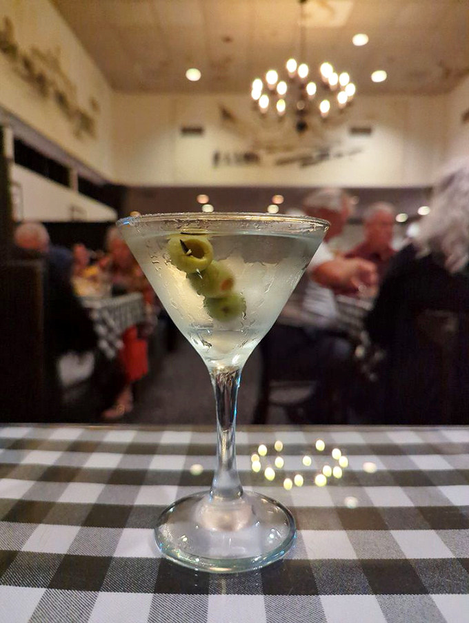 A classic martini with olives standing at attention &ndash; the liquid equivalent of a perfectly pressed tuxedo. James Bond would approve of this timeless cocktail.