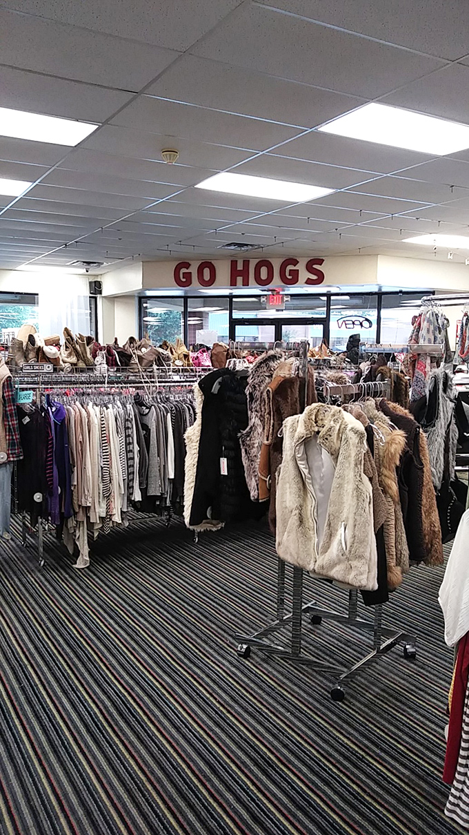 The "Go Hogs" sign reveals the store's Razorback spirit, while fur vests and stylish coats await their next game day outing.