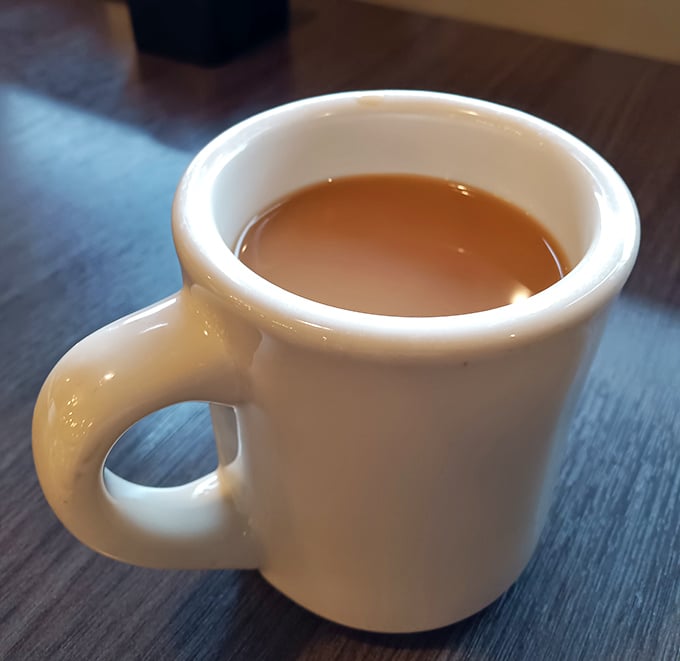 The humble coffee mug, companion to pie decisions and life conversations since time immemorial, stands ready for duty.