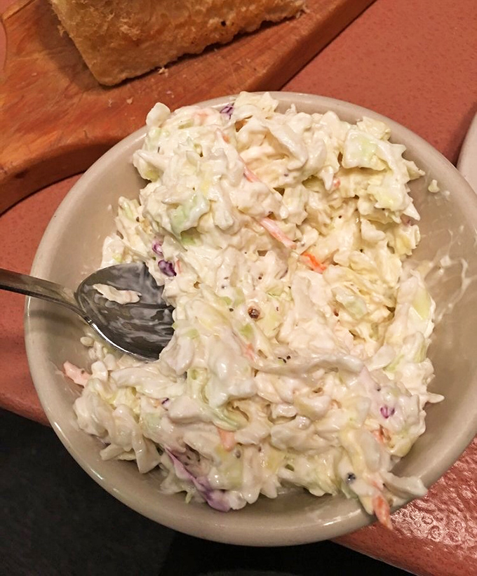 Crisp, creamy coleslaw that knows its supporting role but occasionally steals the scene. The perfect palate cleanser between bites of chicken.