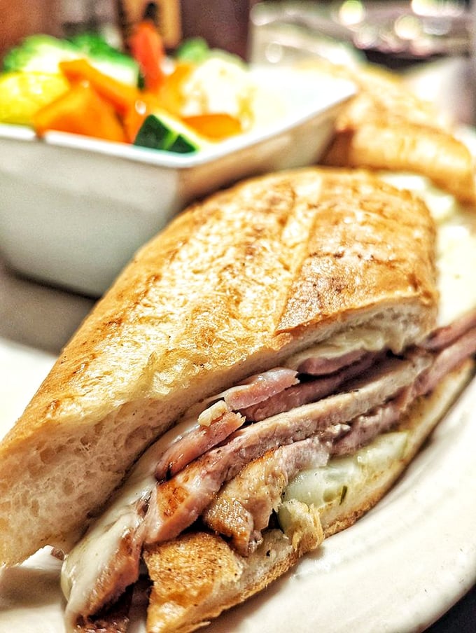 This Cubano sandwich isn't just food &ndash; it's architecture. Layers of flavor pressed between bread that's achieved golden-brown perfection.