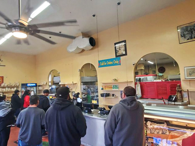 The line forms early at El Modelo, where locals know that good things come to those who wait—and those who order extra green chile.