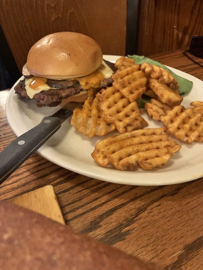 Cheeseburger perfection meets waffle fries in a plate that would make drive-thru fans weep with joy. Fast food executives should take notes.