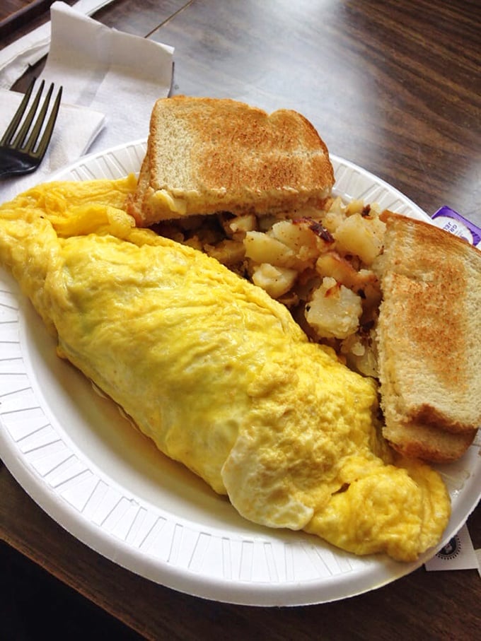 This isn't just breakfast—it's morning poetry written in fluffy eggs and potatoes that somehow taste better on a paper plate.