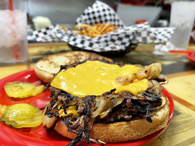 Cheese melting into a bed of caramelized onions and beef&mdash;this isn't just Oklahoma's signature burger, it's edible poetry on a toasted bun.