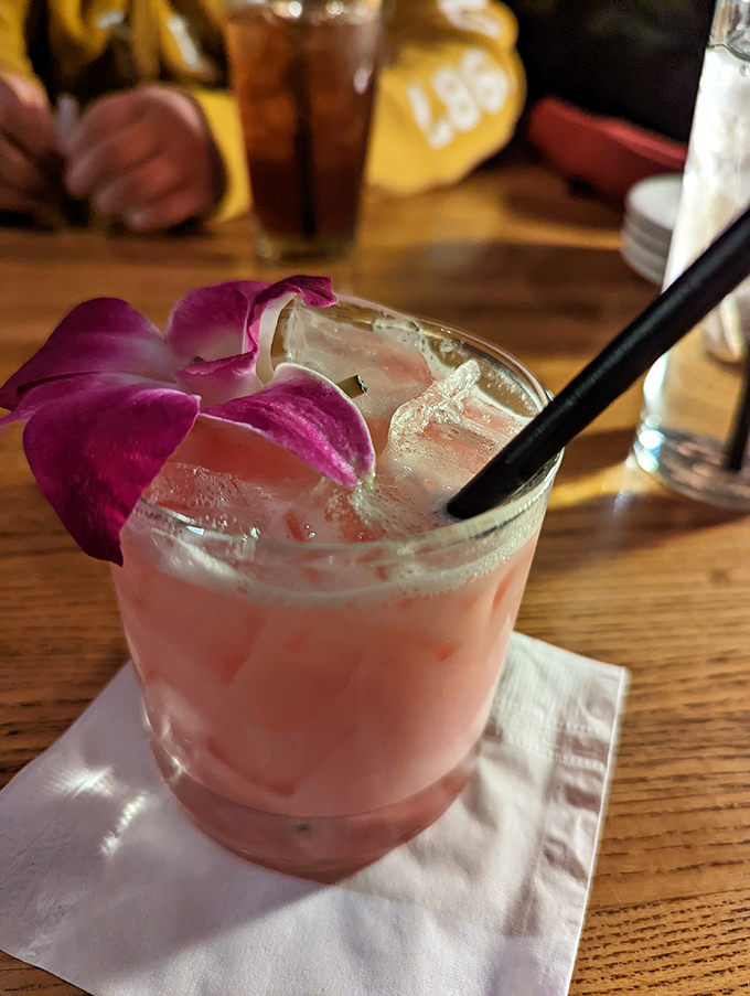 Cocktails at Rip's come with a side of tropical flair. This pink concoction with its orchid garnish is vacation in a glass. 