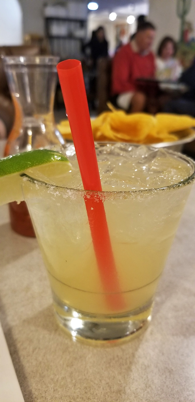 A properly made margarita with salt rim and lime—the universal signal that good decisions are about to be made.