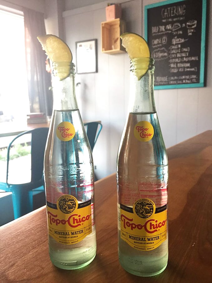 Topo Chico with lime: the hydration choice of sophisticated taco enthusiasts everywhere. Like sparkling water but with personality and better outfit choices.