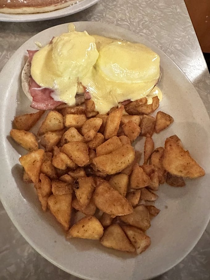 Eggs Benedict done so right it should be illegal. That hollandaise sauce is basically sunshine in edible form.