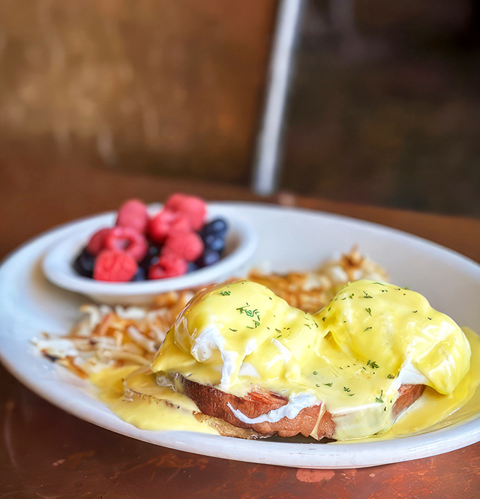 Eggs Benedict done right is poetry on a plate. That hollandaise sauce cascading down like a yellow waterfall of buttery bliss.