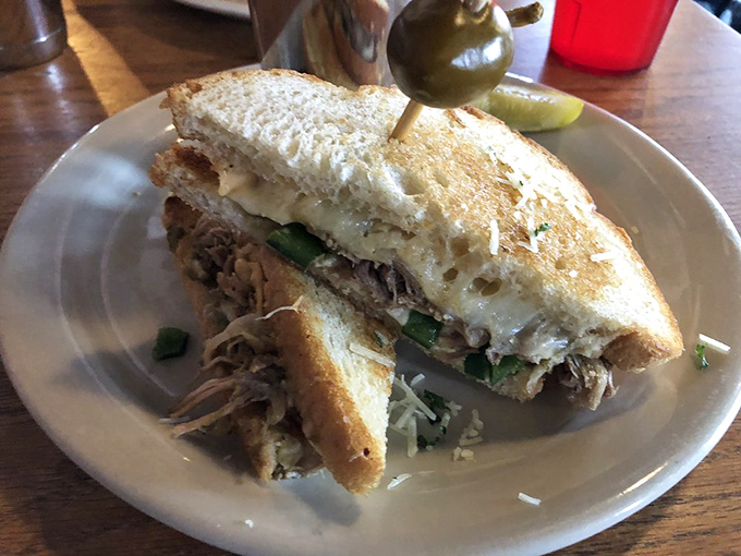 This pulled pork sandwich doesn't just satisfy hunger&mdash;it creates memories with each perfectly balanced, cheese-draped bite.