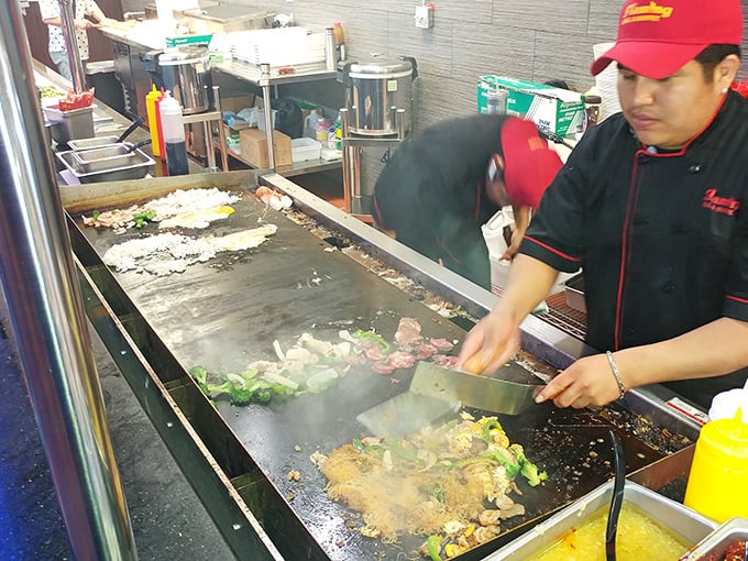 The hibachi chef performs his sizzling symphony, transforming your chosen ingredients into a customized masterpiece. Part cooking, part performance art, all delicious.