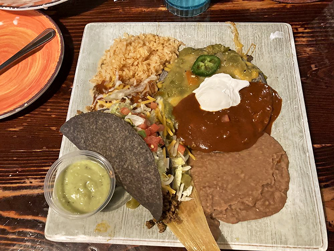 Christmas came early with this "red and green" enchilada plate that showcases New Mexico's finest debate: which chile sauce reigns supreme?