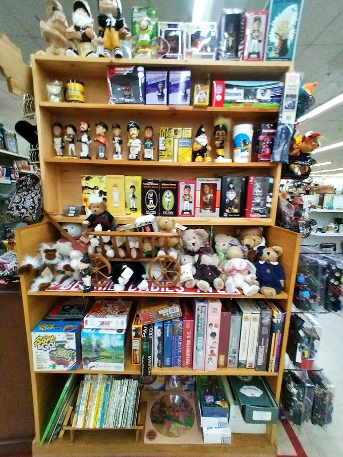Teddy bears holding silent court beneath celebrity bobbleheads&mdash;a peculiar parliament of collectibles spanning generations of American pop culture.