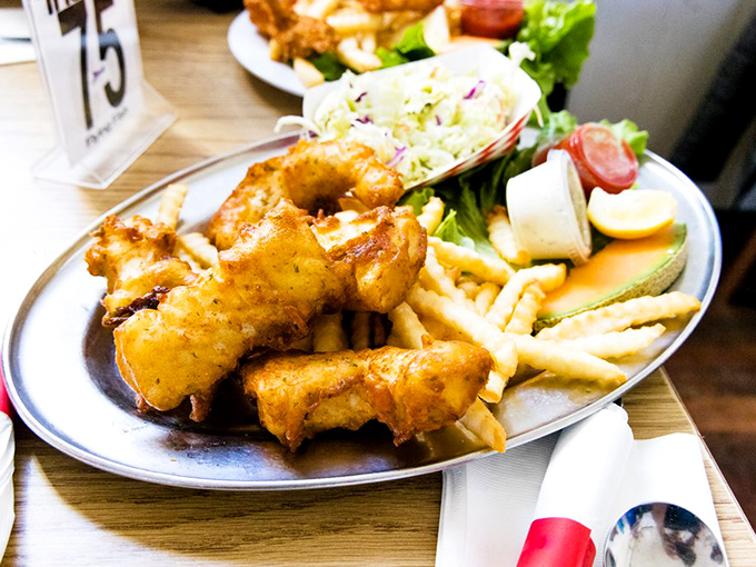 Fish and chips elevated from pub grub to coastal masterpiece. That golden batter holds secrets that fast food chains would kill for.