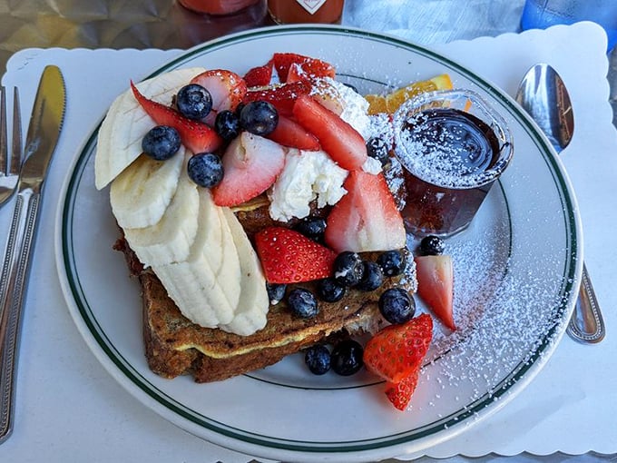 French toast that makes you question why you ever settled for lesser versions. Fruit and whipped cream: breakfast's power couple.