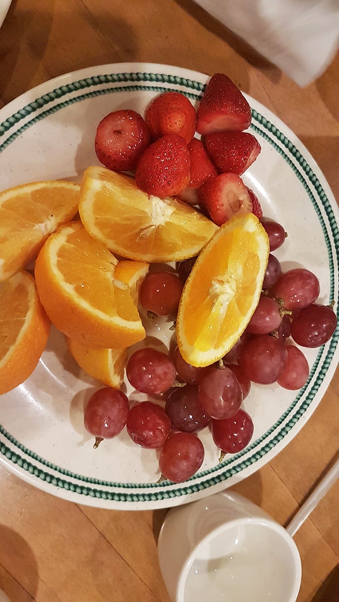 Fresh fruit offers a moment of virtuous eating before returning to the less righteous sections of the buffet. Balance is everything.