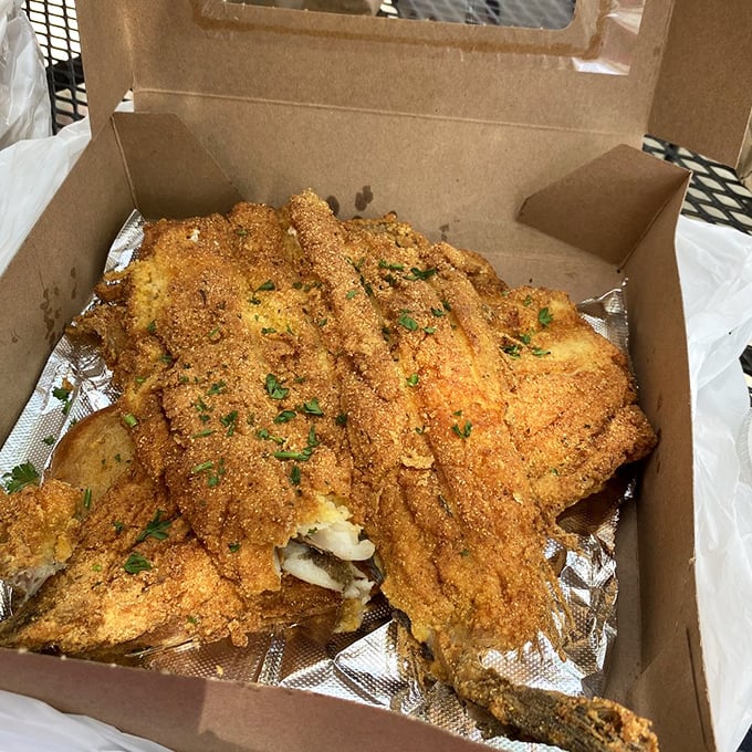 Lake trout with a cornmeal crust so perfect it deserves its own trophy. Takeout packaging can barely contain its golden-fried magnificence.