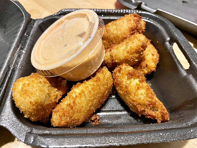 Golden-fried artichoke hearts that crunch like autumn leaves, paired with a dipping sauce that means business.