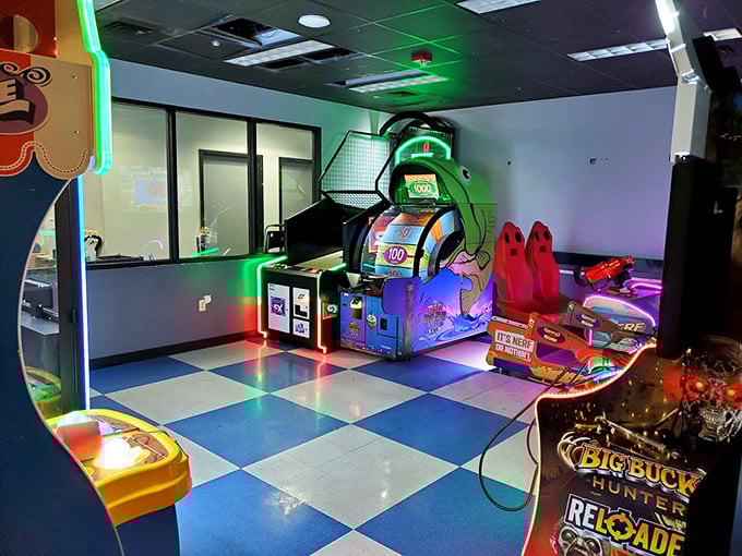 The arcade area glows with digital temptations, offering electronic thrills when your bowling arm needs a break from all that pendulum action.