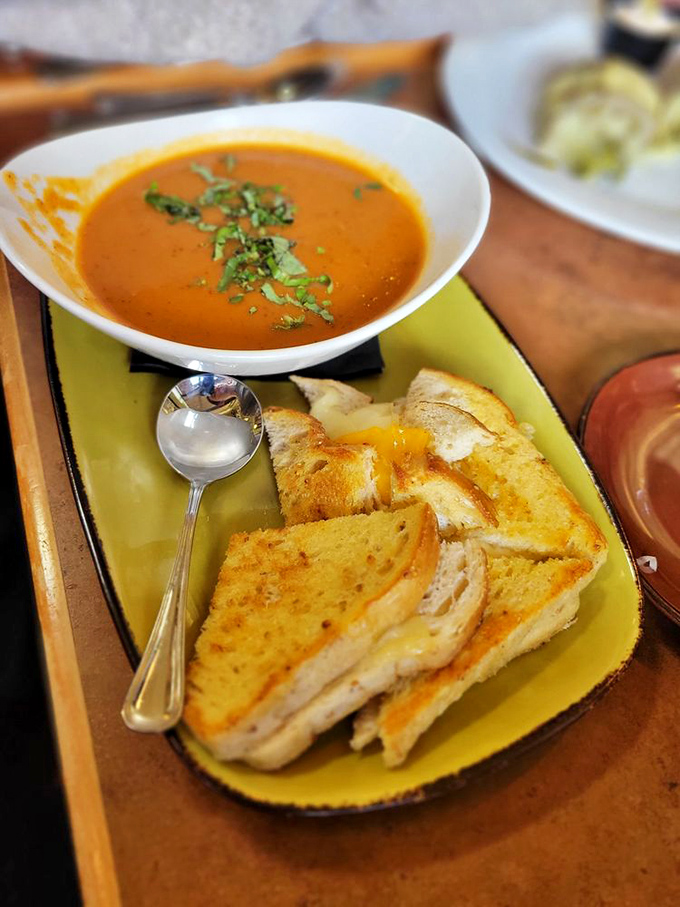 Grilled cheese and tomato bisque: childhood comfort reimagined for grown-up taste buds, served on dinnerware that says, "Yes, you're still adulting."