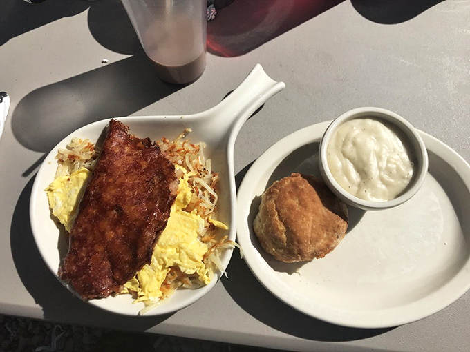 The holy trinity of breakfast: creamy gravy, golden hash browns, and eggs that know exactly how to start your day right.