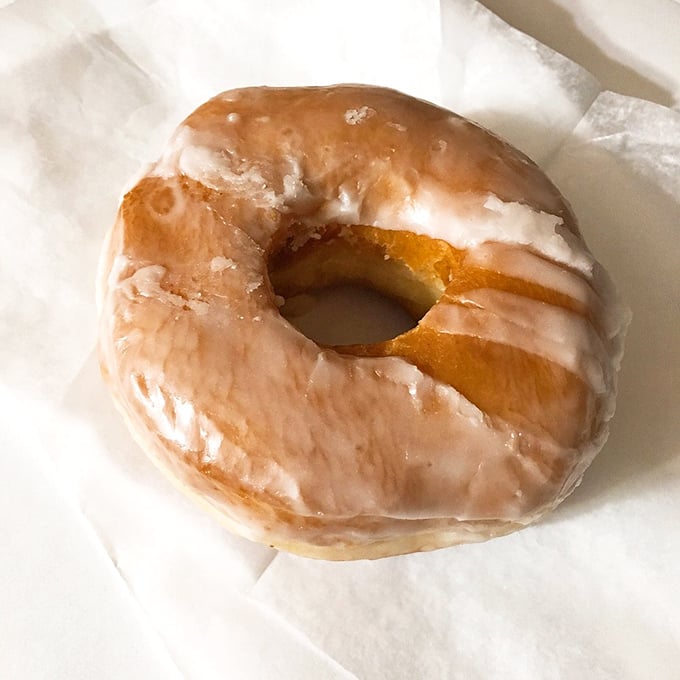 The humble glazed donut&mdash;deceptively simple, impossibly delicious. That translucent coating captures light like stained glass in a sugar cathedral.