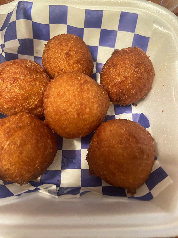 Hushpuppies so perfectly golden they actually might whisper "hush, puppy" as they cool on your plate.